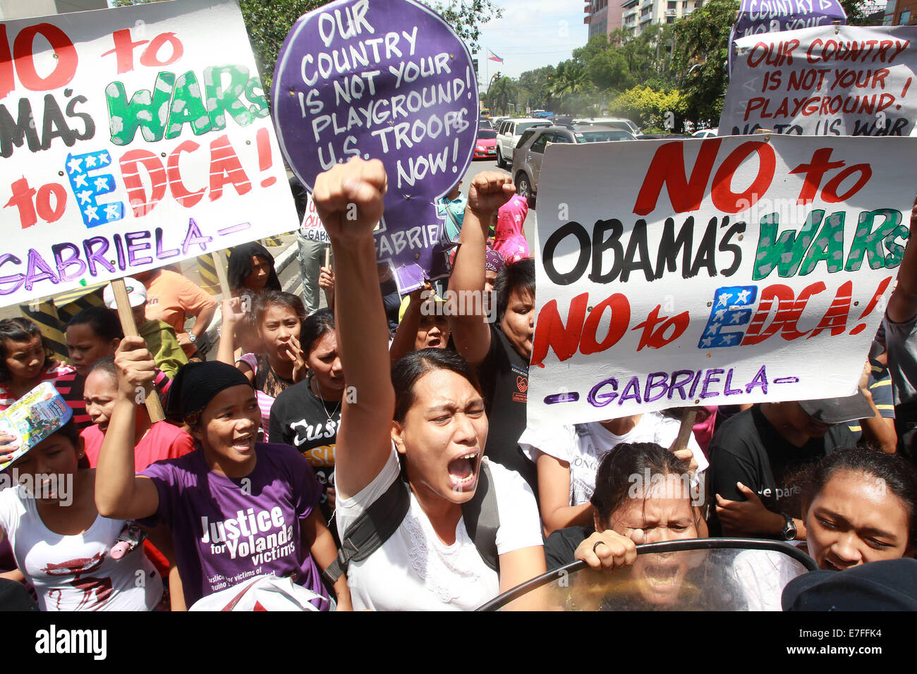 Manila, Philippines. 16th Sep, 2014. Protesters hold placards against ...
