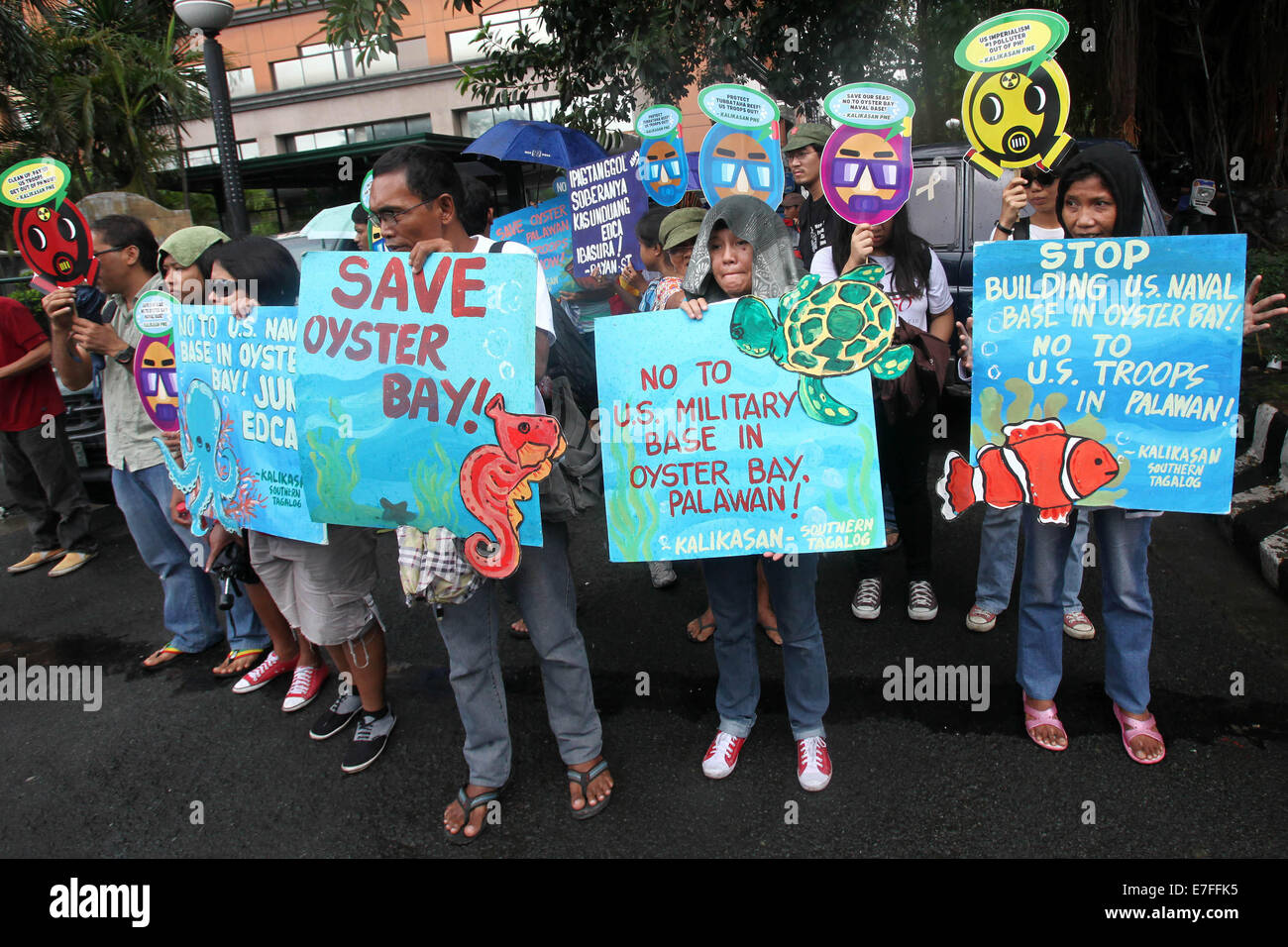 Manila, Philippines. 16th Sep, 2014. Protesters hold placards against ...