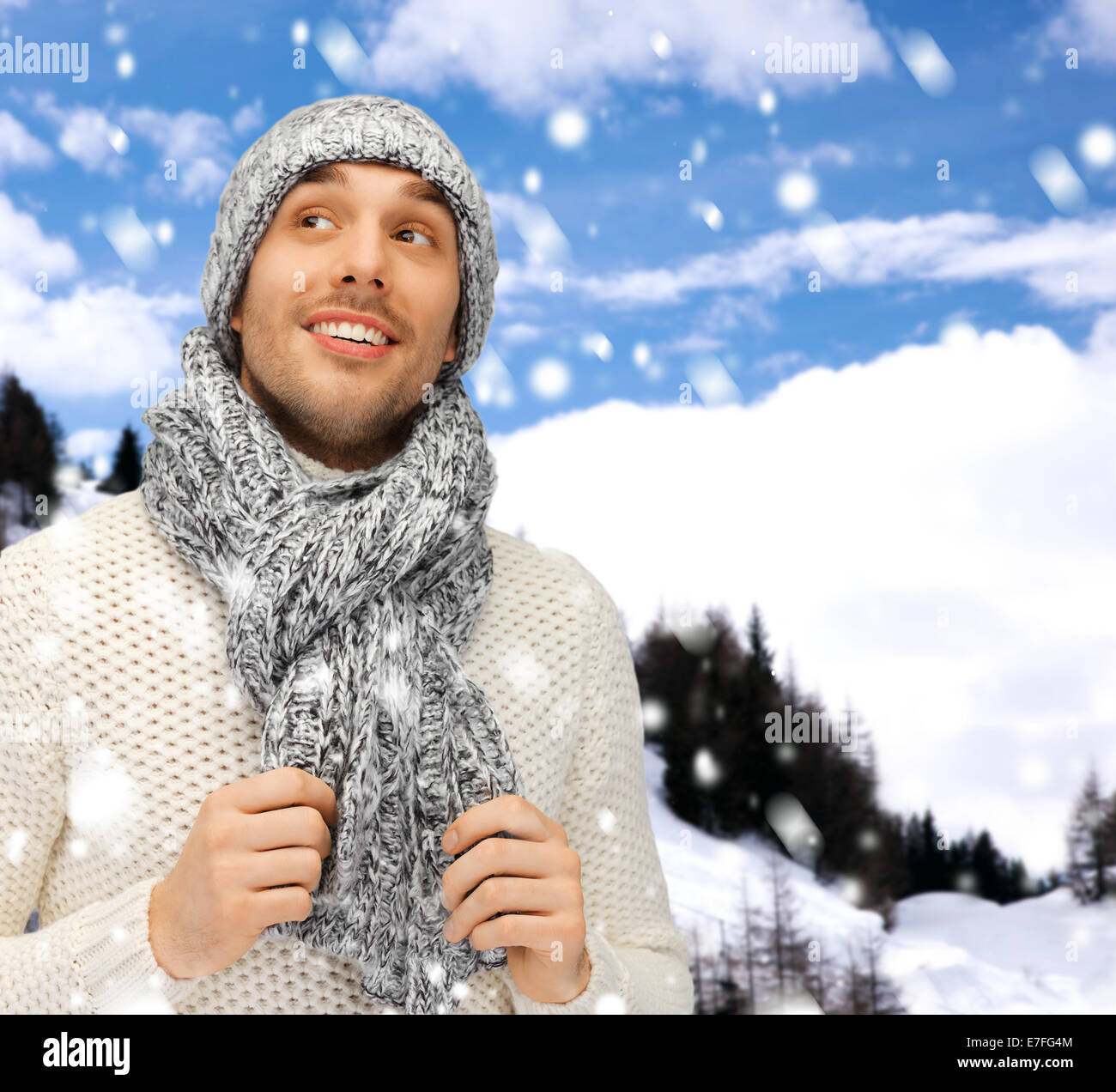 handsome man in warm sweater, hat and scarf Stock Photo - Alamy
