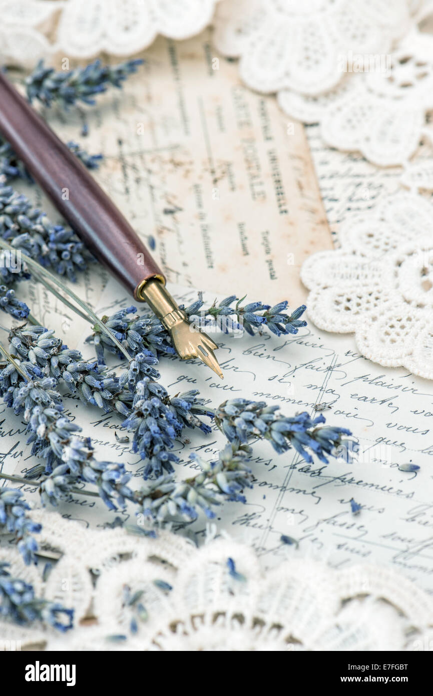 vintage ink pen, dried lavender flowers and old love letters. retro ...
