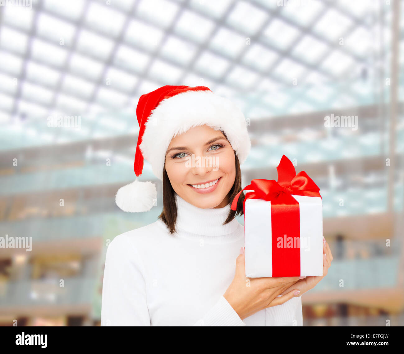 smiling woman in santa helper hat with gift box Stock Photo - Alamy