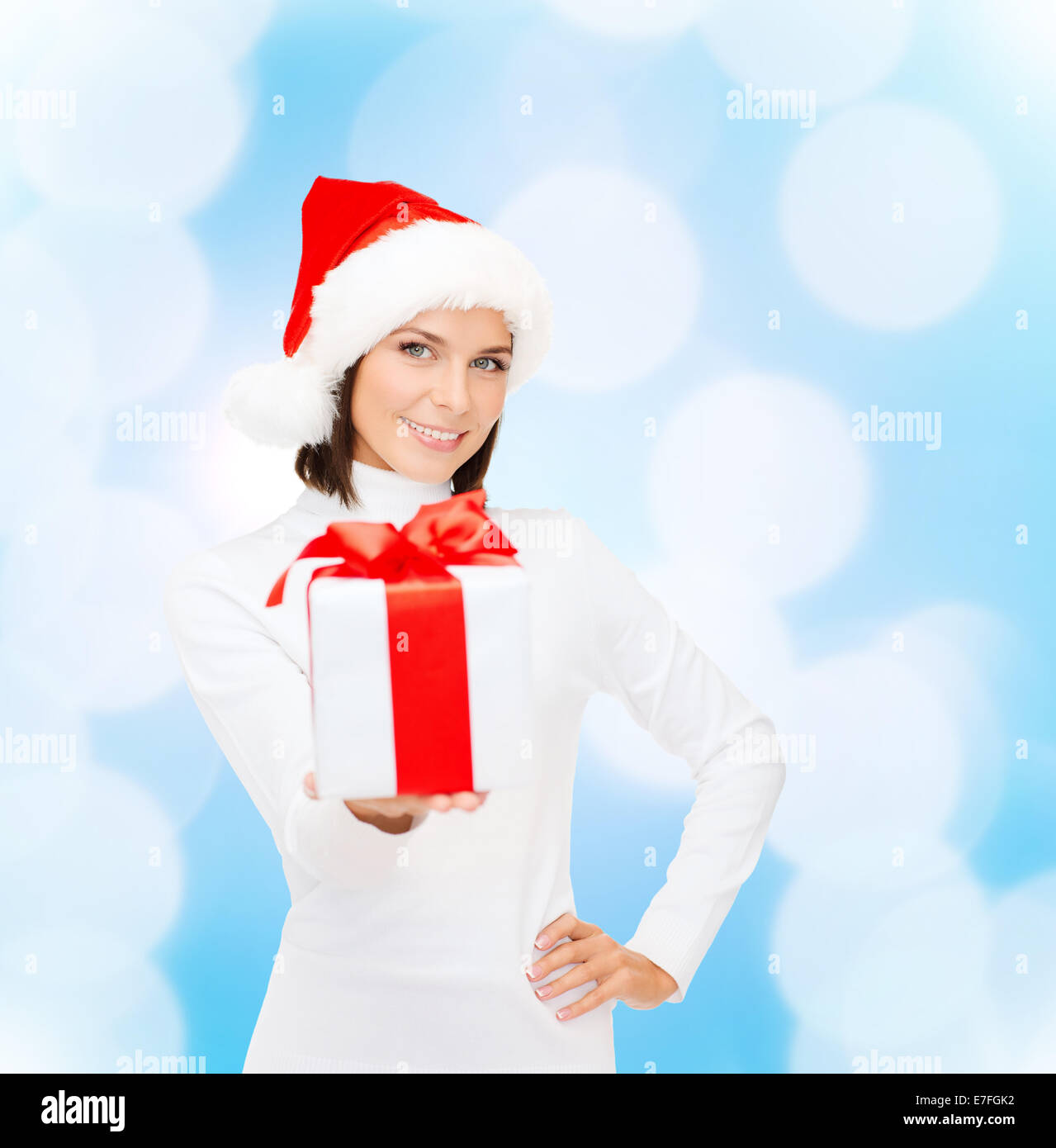 smiling woman in santa helper hat with gift box Stock Photo - Alamy