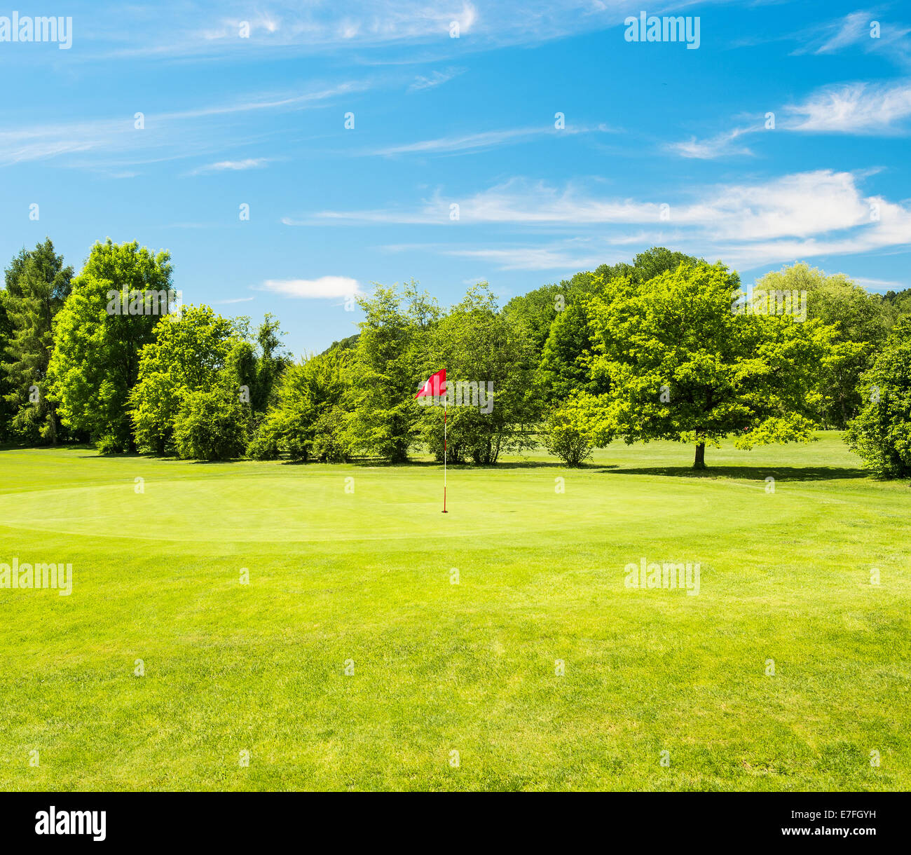 green field and beautiful blue sky. european golf course landscape ...