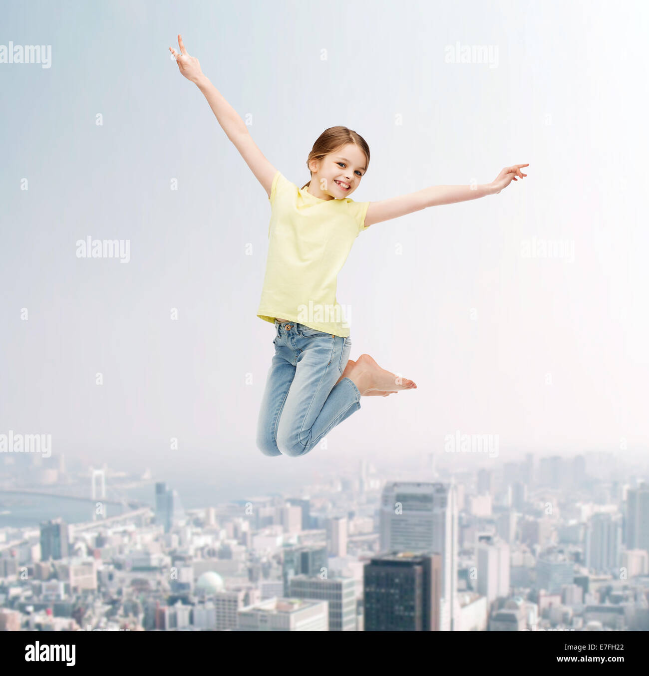 Child jumping hands air hi-res stock photography and images - Alamy