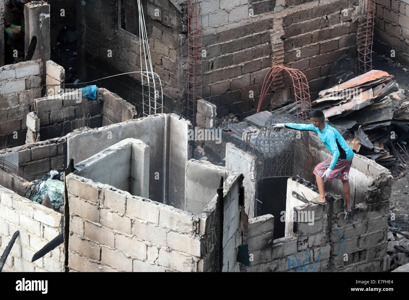 Paranaque City, Philippines. 16th Sep, 2014. A resident collects ...