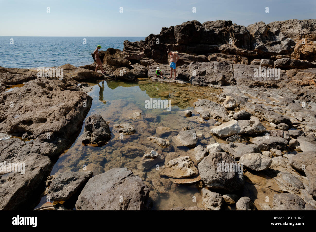 Fishing in a Rock Pool in Castiglioncello Stock Photo - Alamy