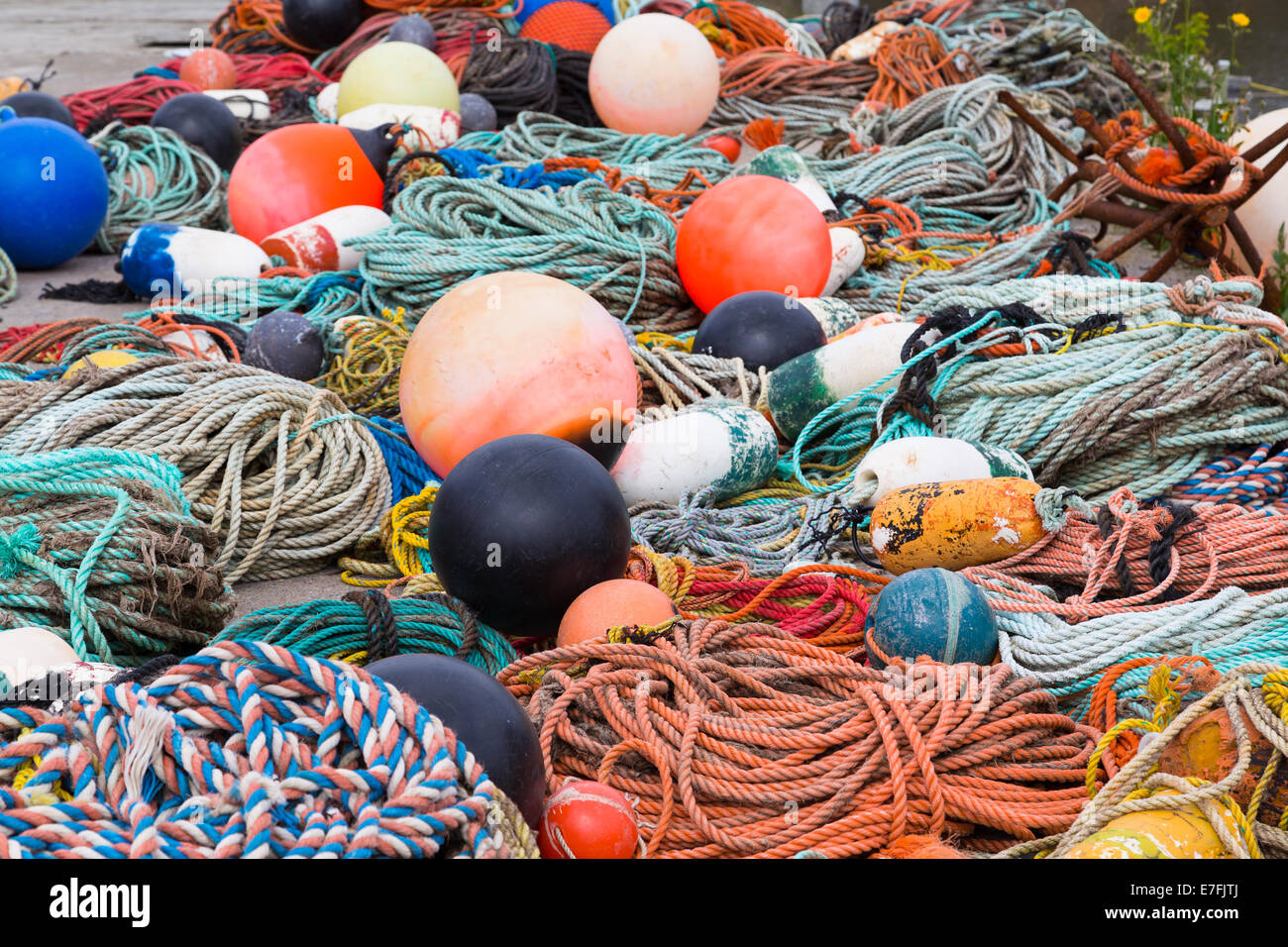 Fishing ropes and equipment during the day on the floor Stock Photo - Alamy