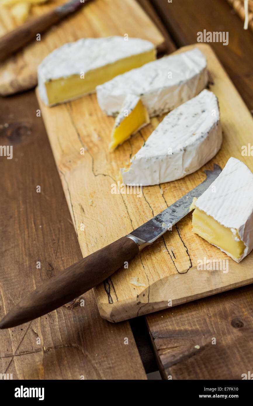 Brie cheese at the market Stock Photo - Alamy