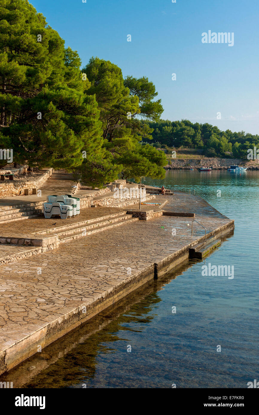 Empty terraced beach during morning in Mina bay in Jelsa, Hvar island ...