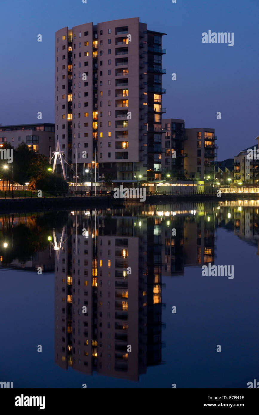 Lights glowing in apartments overlooking Roath Dock, Cardiff Bay, South ...