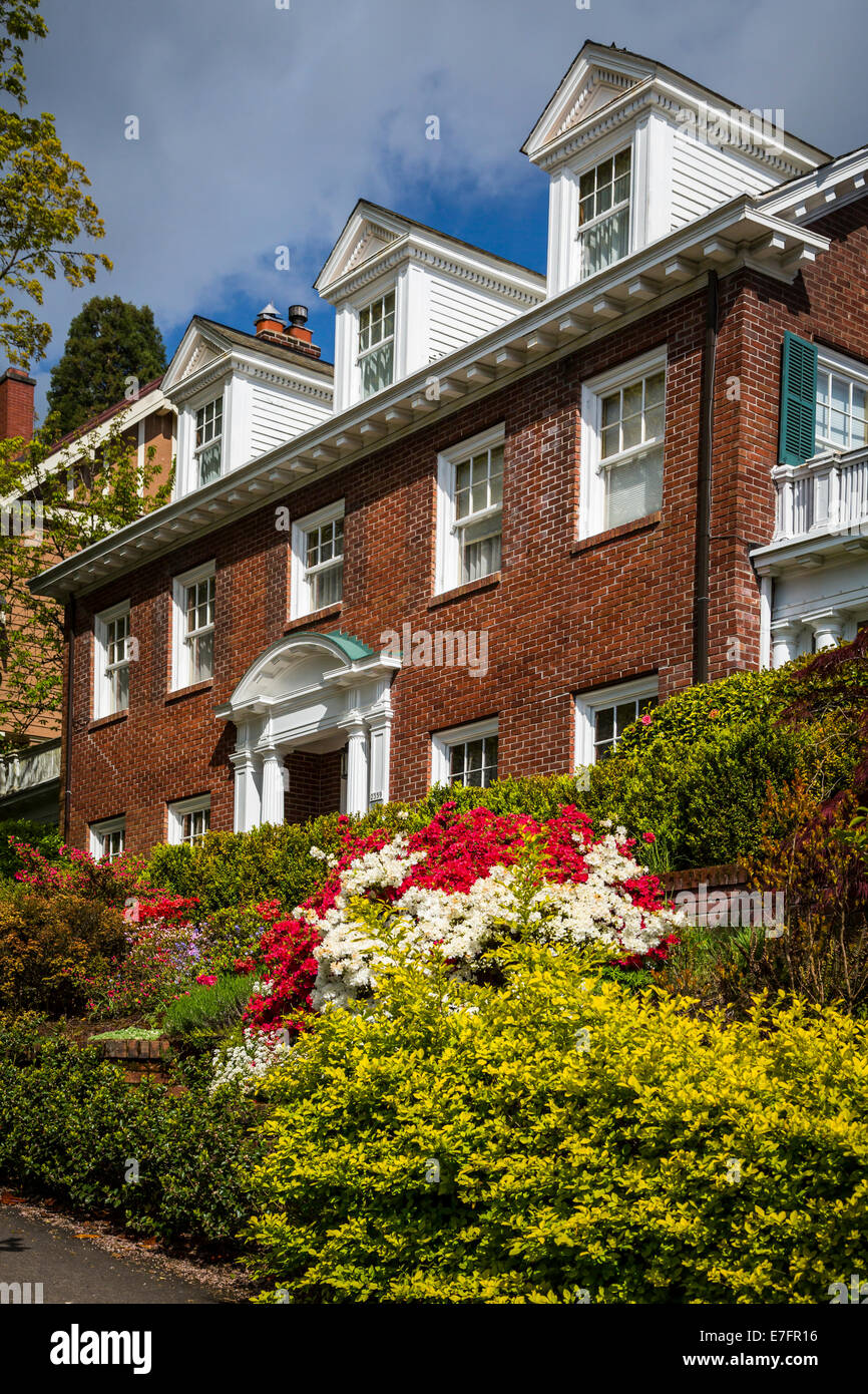 A home with decorative spring flower bushes in Portland, Oregon, USA ...