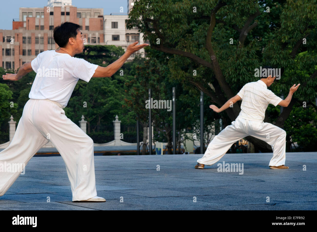 China, Shanghai, morning tai chi exercise on The Bund. Shanghi Bund ...