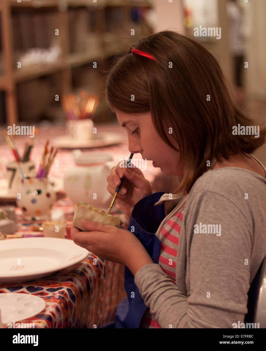 girl painting pottery Stock Photo - Alamy