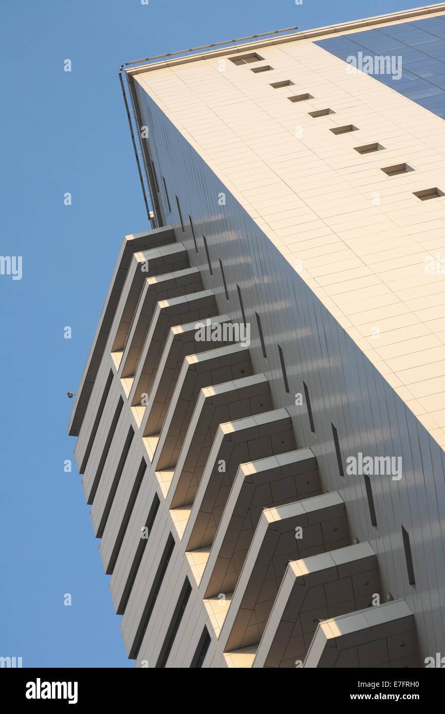 Gray office building tower on blue sky Stock Photo - Alamy