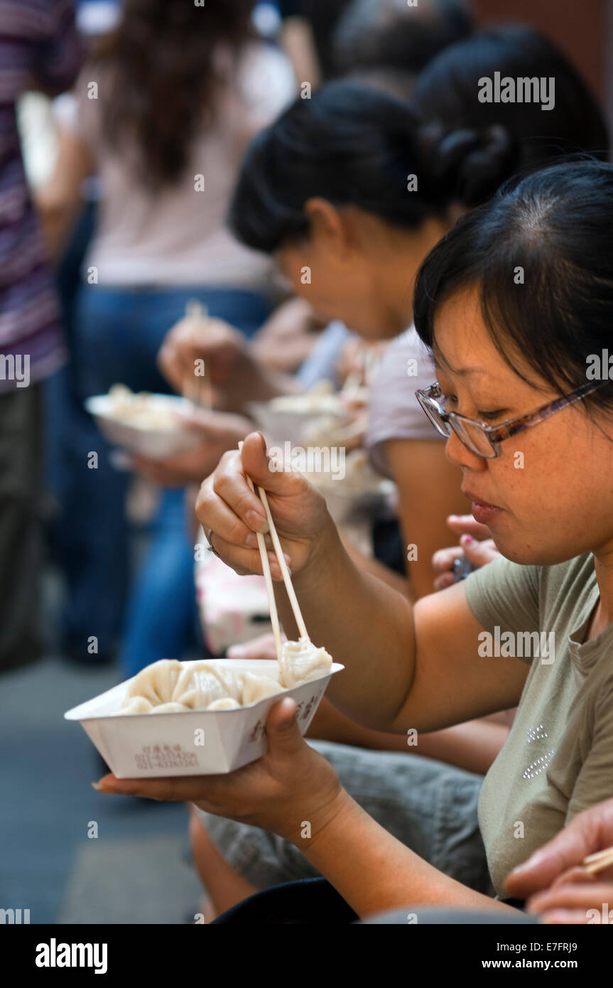 Two Young Chinese Women Enjoying Nanxiang Dumpling House Yuyuan Bazaar