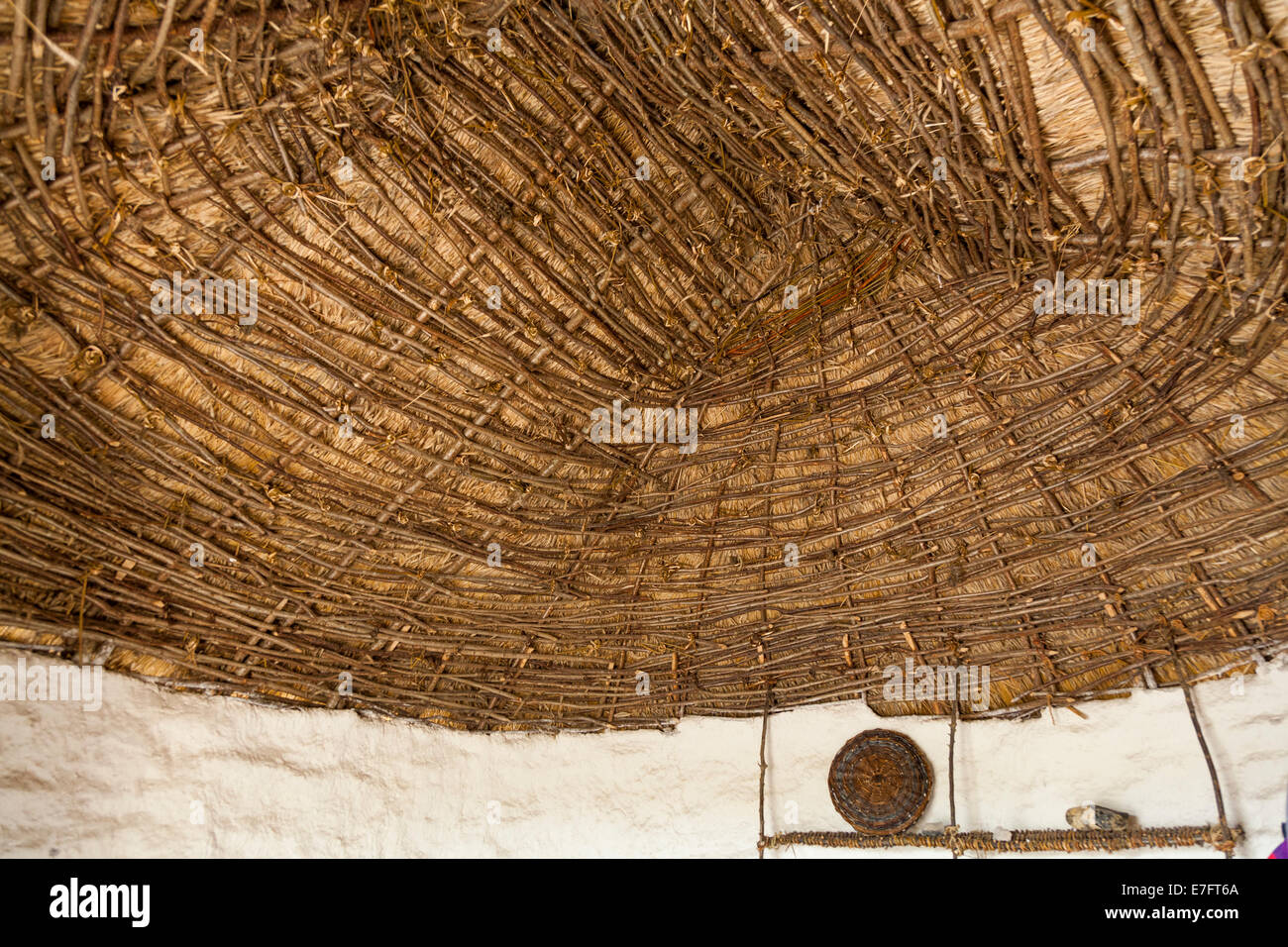 Thatched roof ceiling inside a recreated Neolithic hut stone age ...