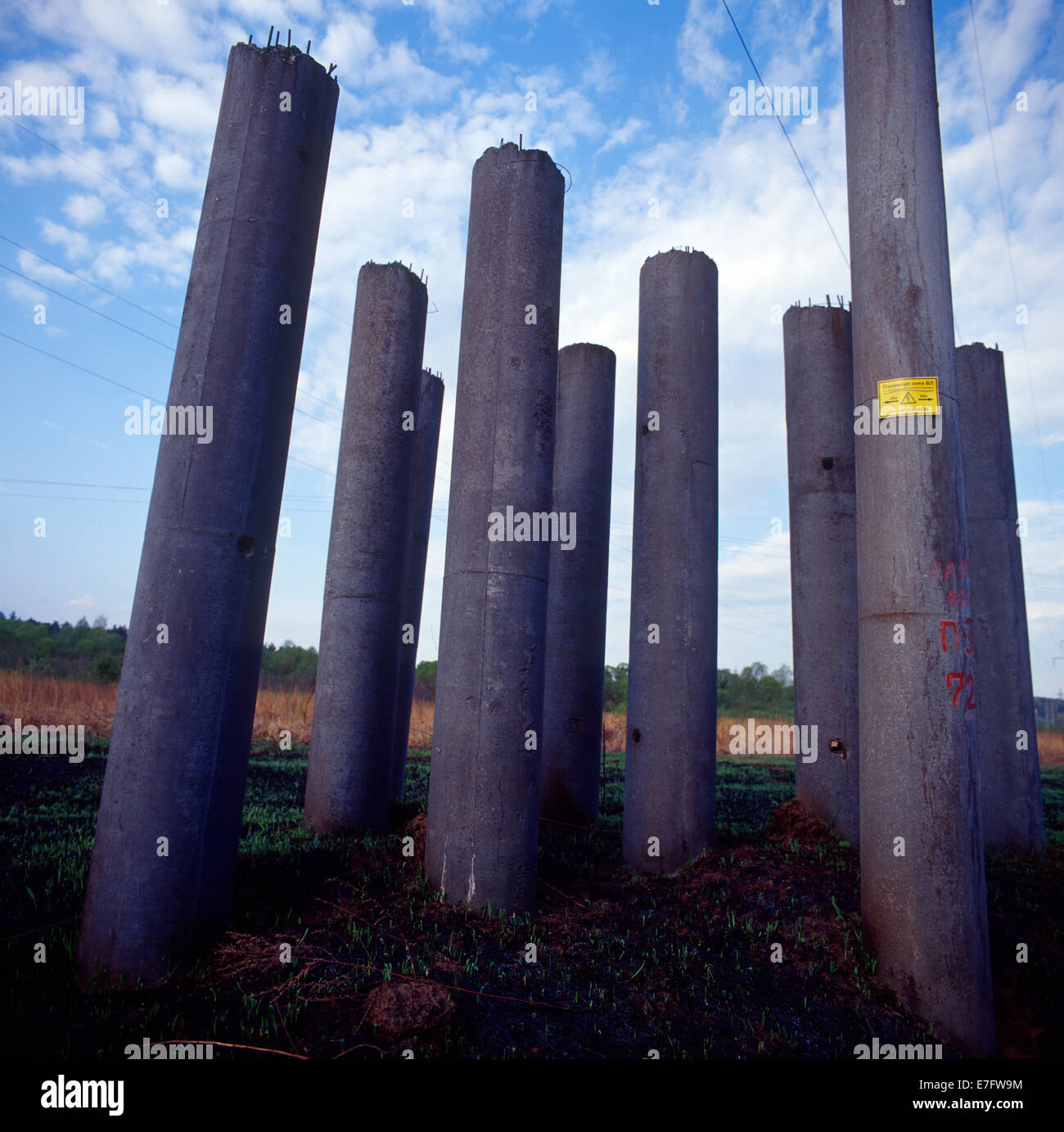 Nine reinforced concrete posts Stock Photo - Alamy