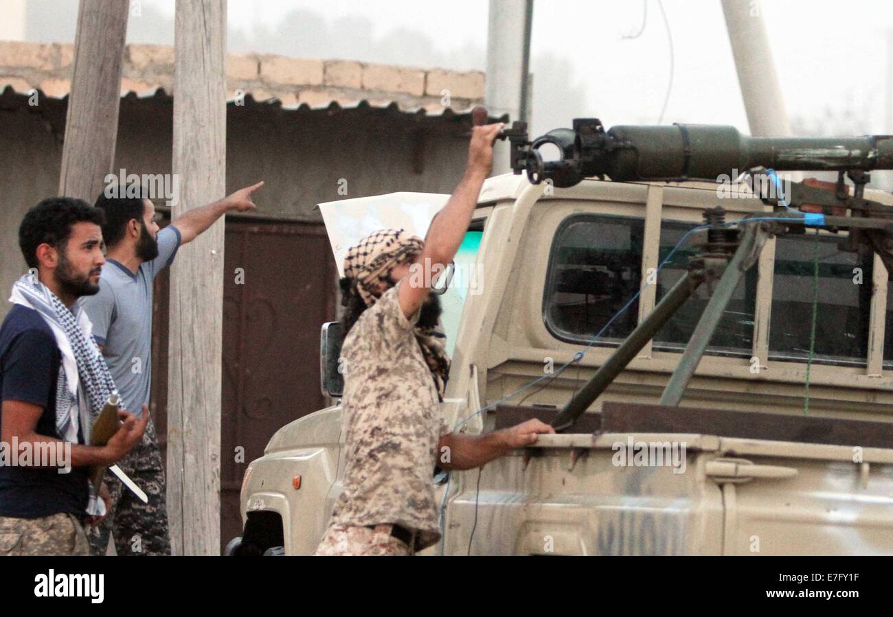 Tripoli, Libya. 16th September, 2014. A Libya Dawn fighter adjusts a ...
