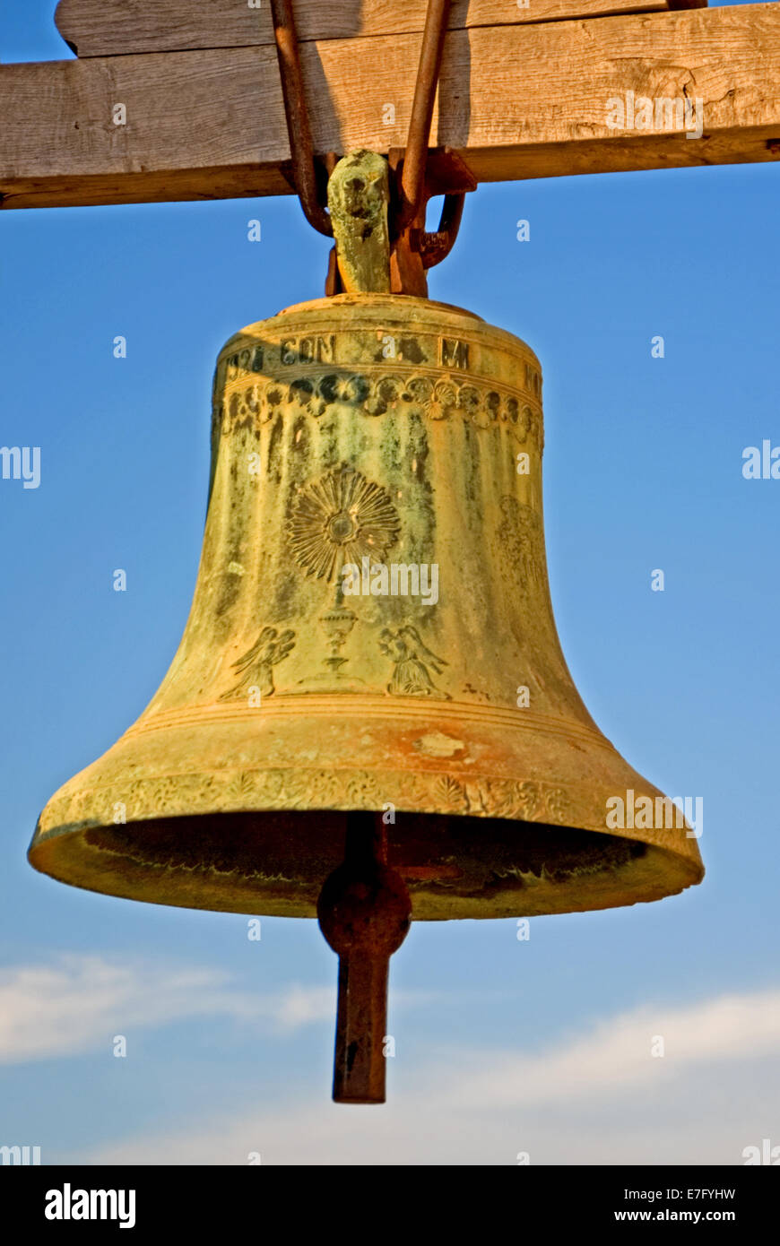 Old rusted bell hanging from timber beams in the old castle at Calafell ...