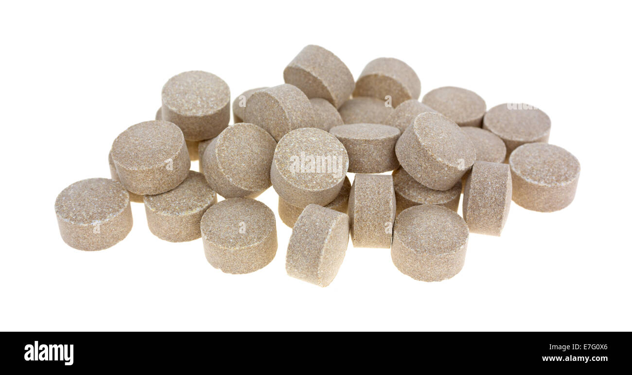 A group of ginseng tablets on a white background Stock Photo - Alamy