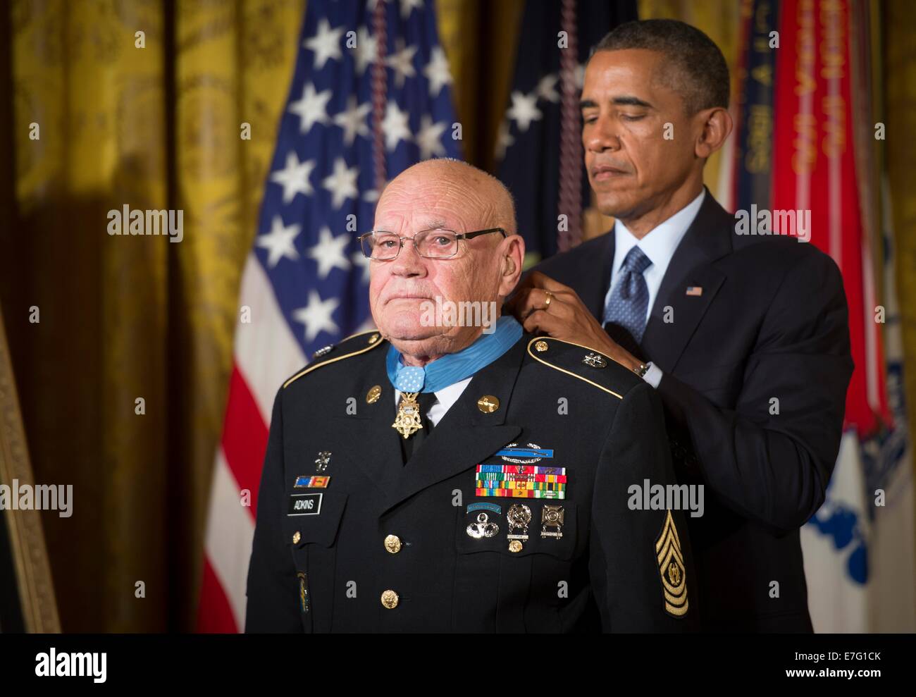 US President Barack Obama awards the Medal of Honor to Army Command Sgt. Maj. Bennie G. Adkins ...