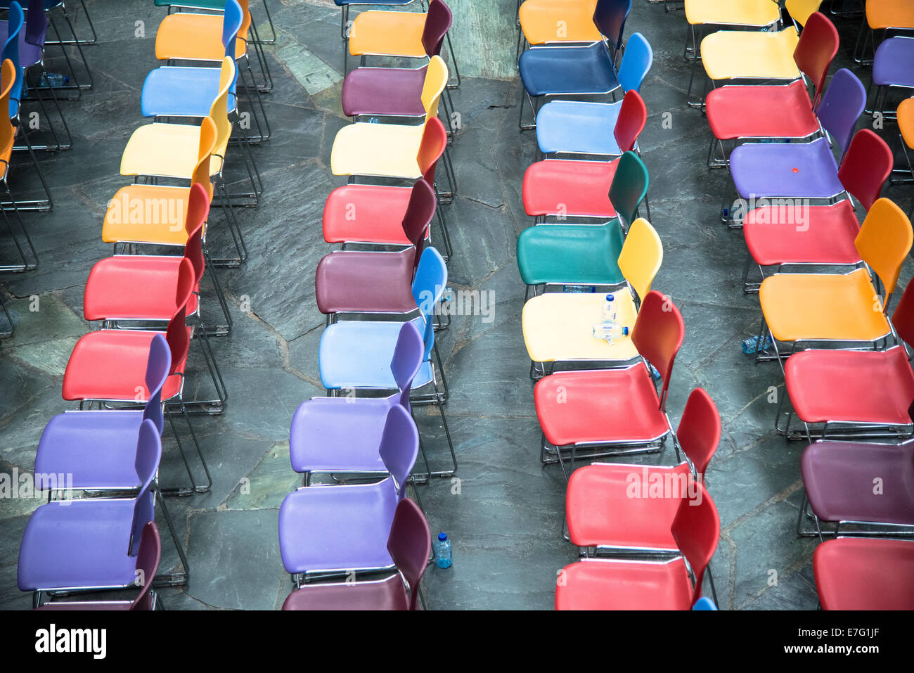 rows of colorful empty chairs in theatre Stock Photo - Alamy