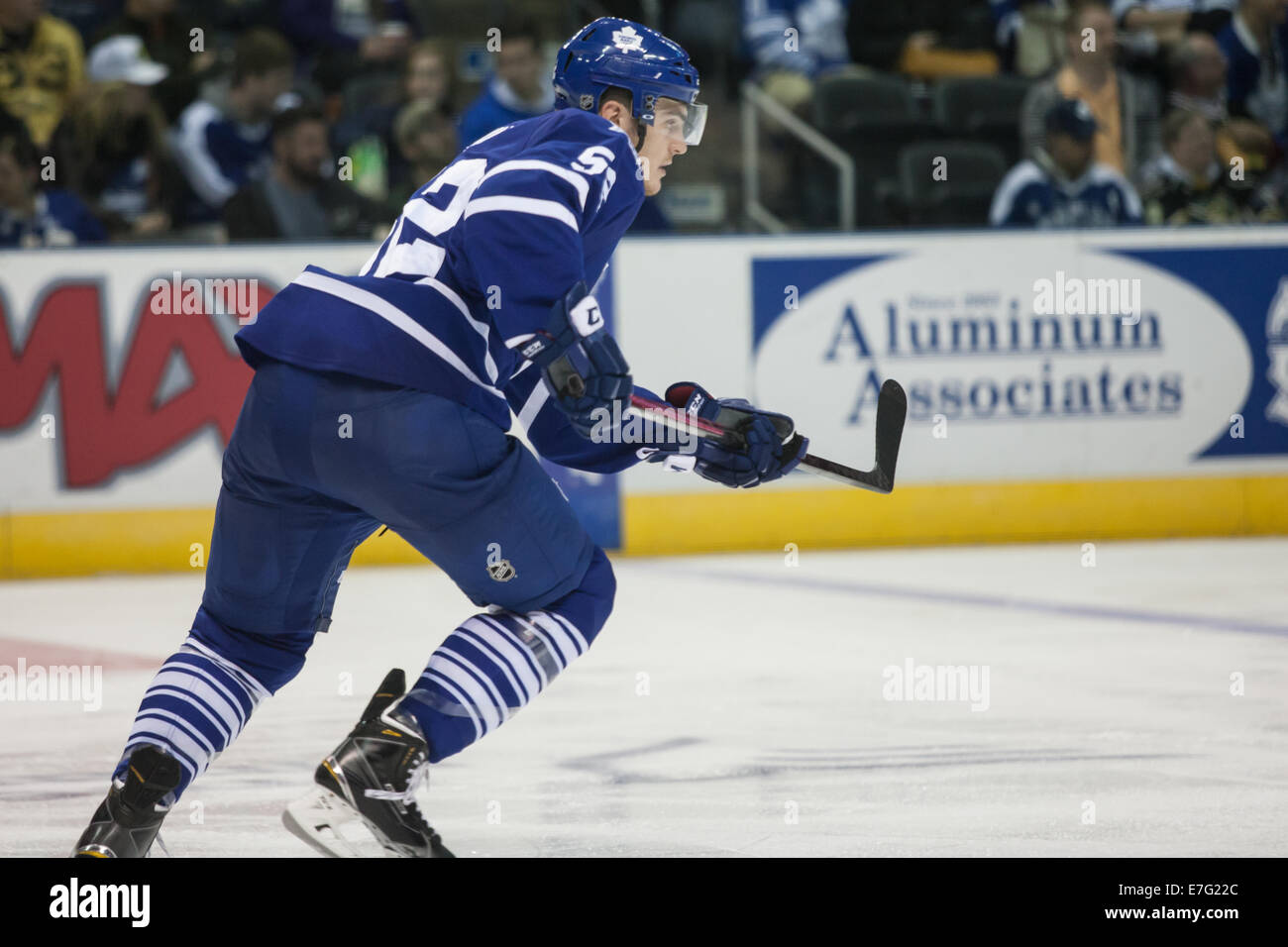 September 14, 2014. Matt Finn (52) of the Toronto Maple Leafs follows ...