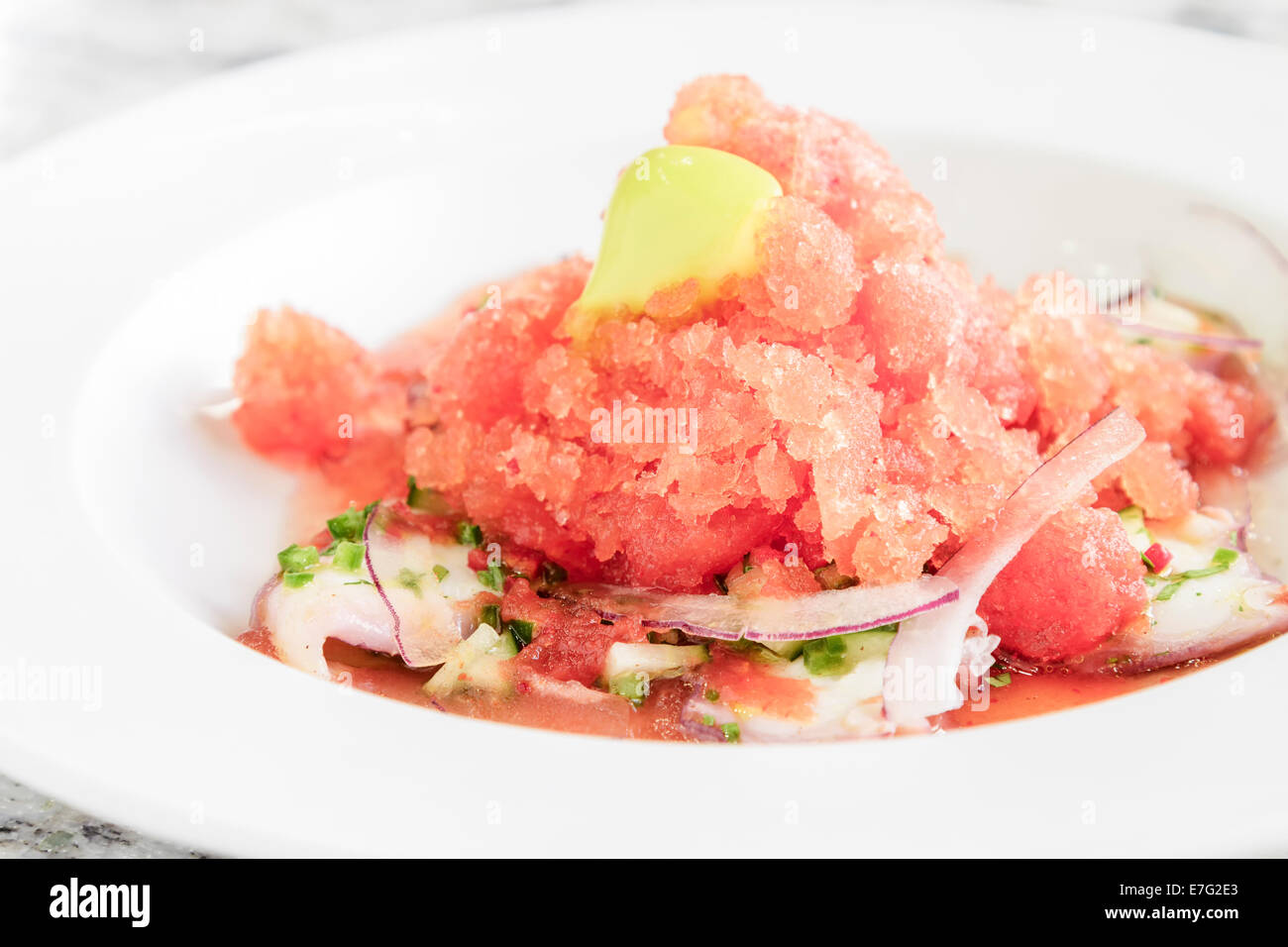 Poached octopus with jalapeno cucumber brunoise and red onion shavings ...