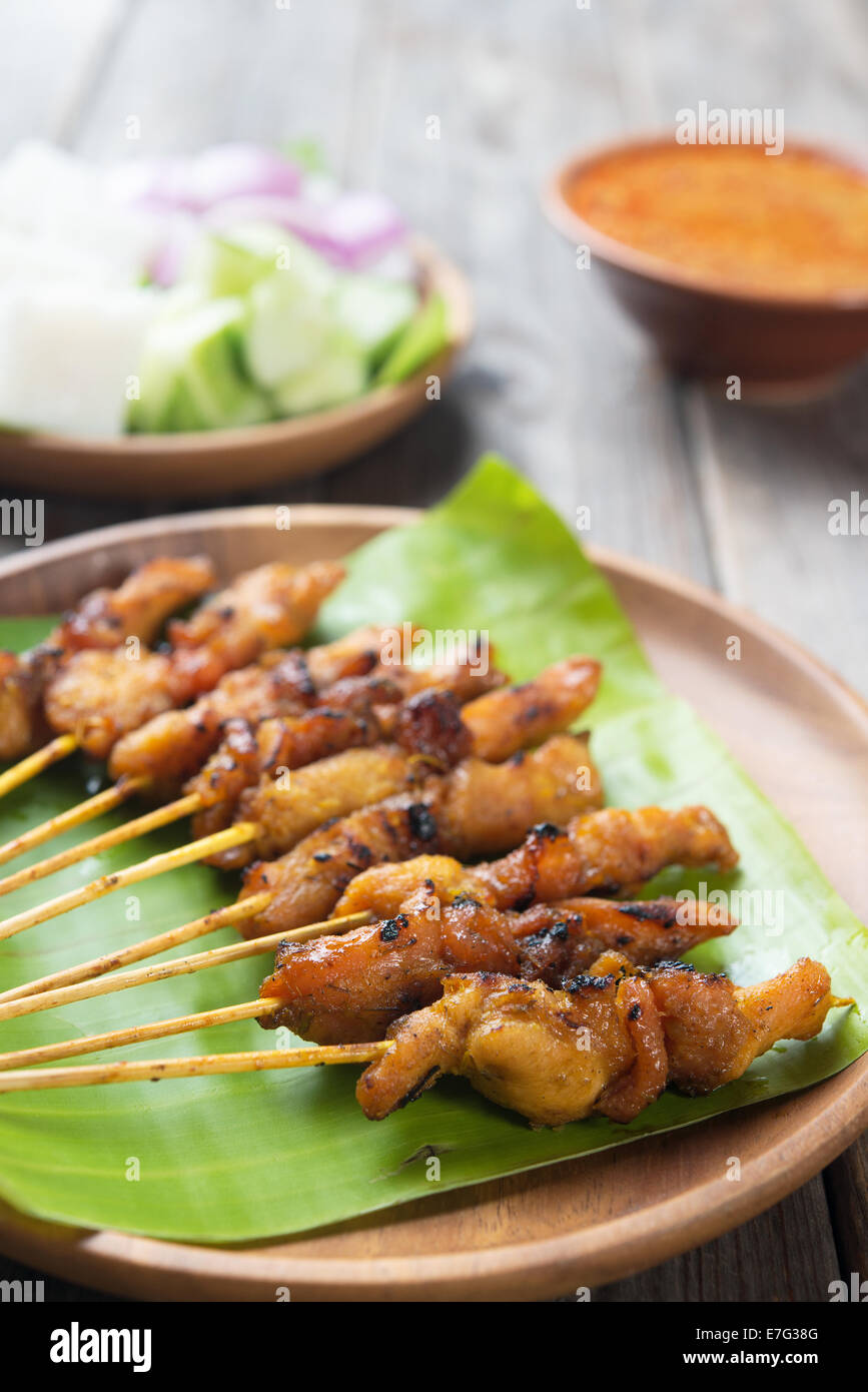 Close up chicken satay on wooden dining table, one of famous local ...