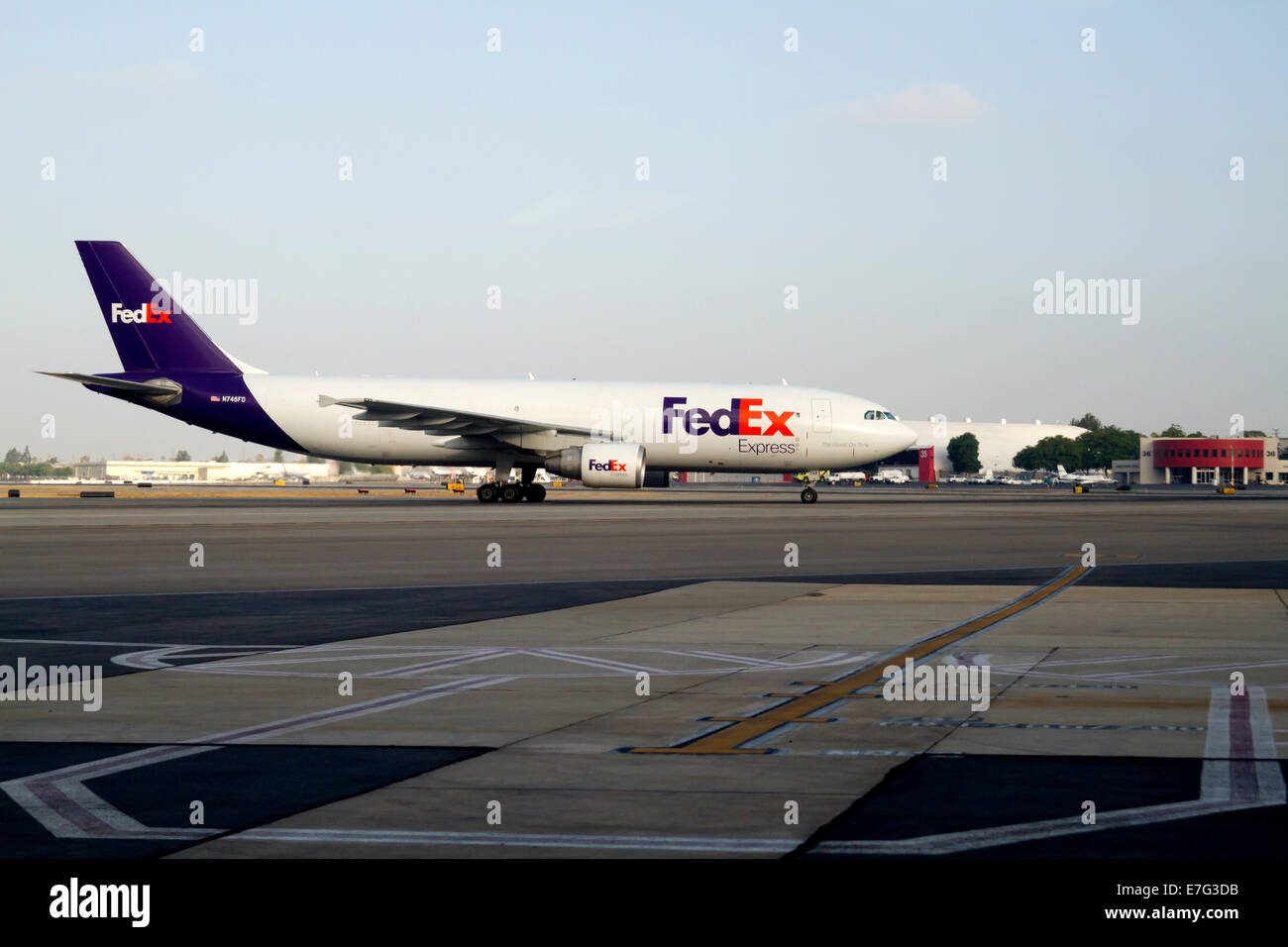 Federal Express cargo jet on the runway preparing for take-off at ...
