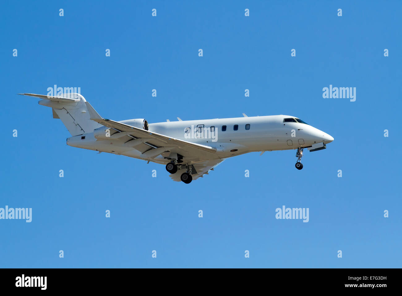 Private jet on landing approach with landing gear down Stock Photo - Alamy