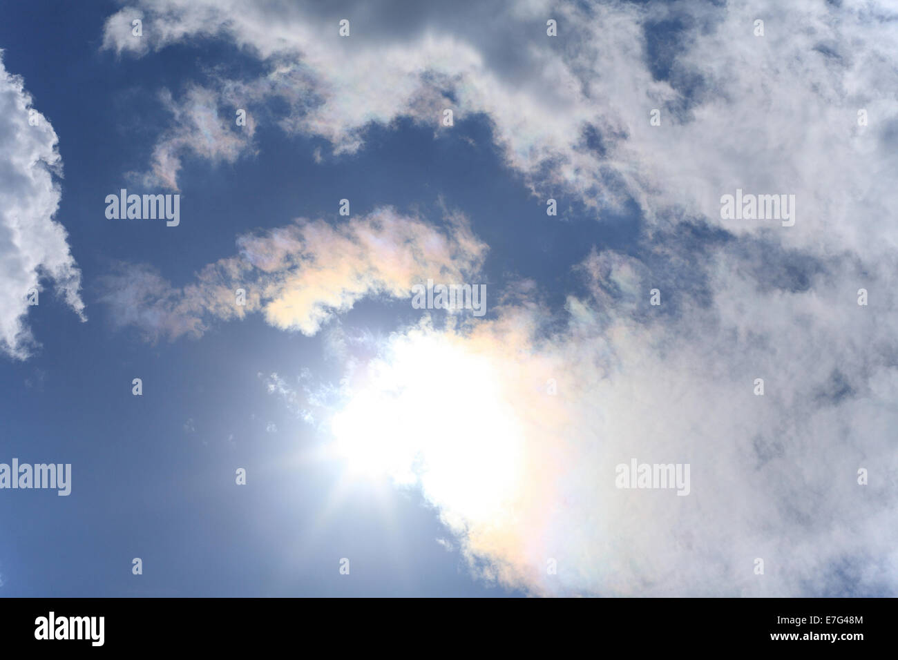 sun and white clouds on sky background Stock Photo - Alamy