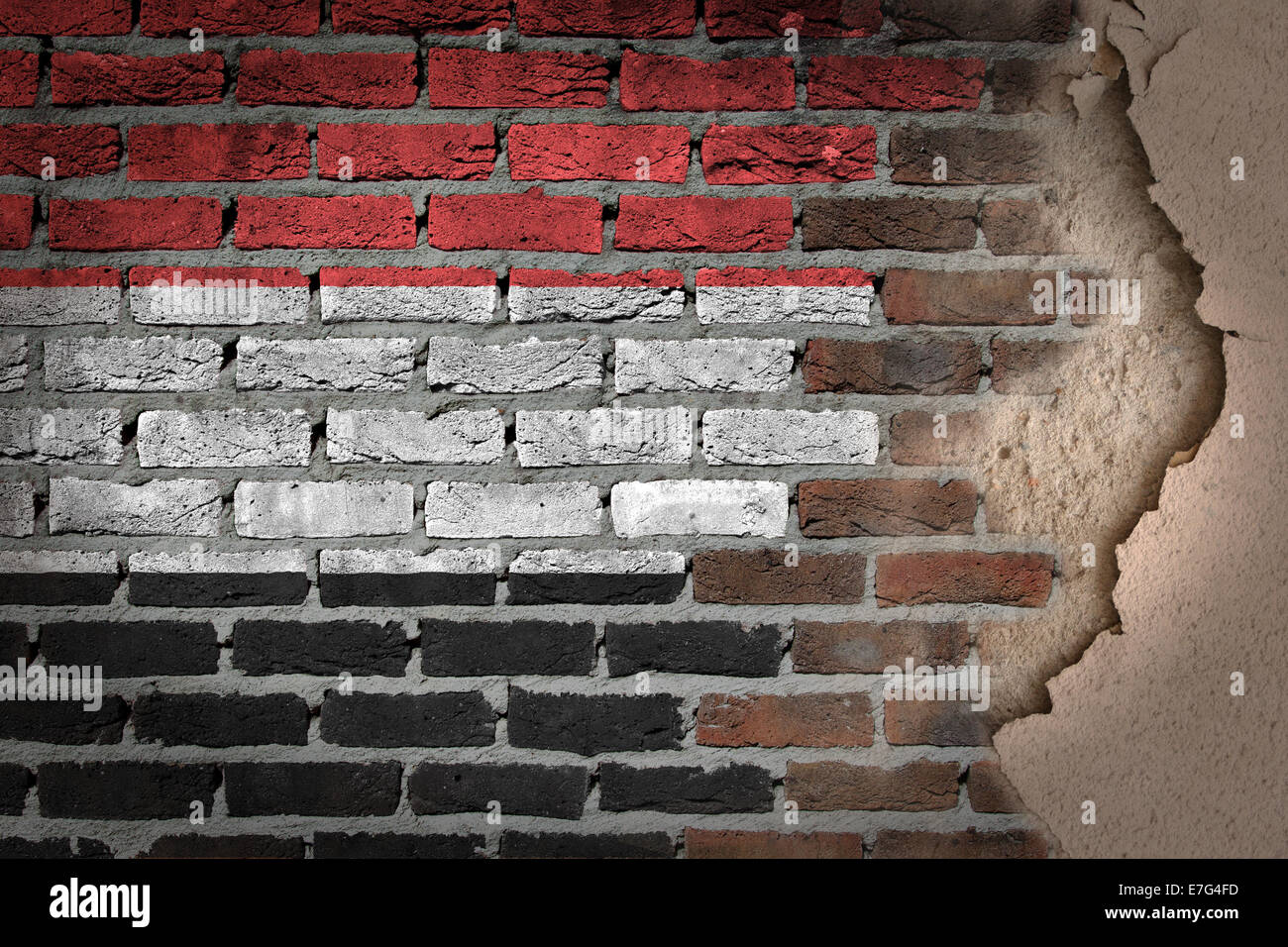 Dark brick wall texture with plaster - flag painted on wall - Yemen ...