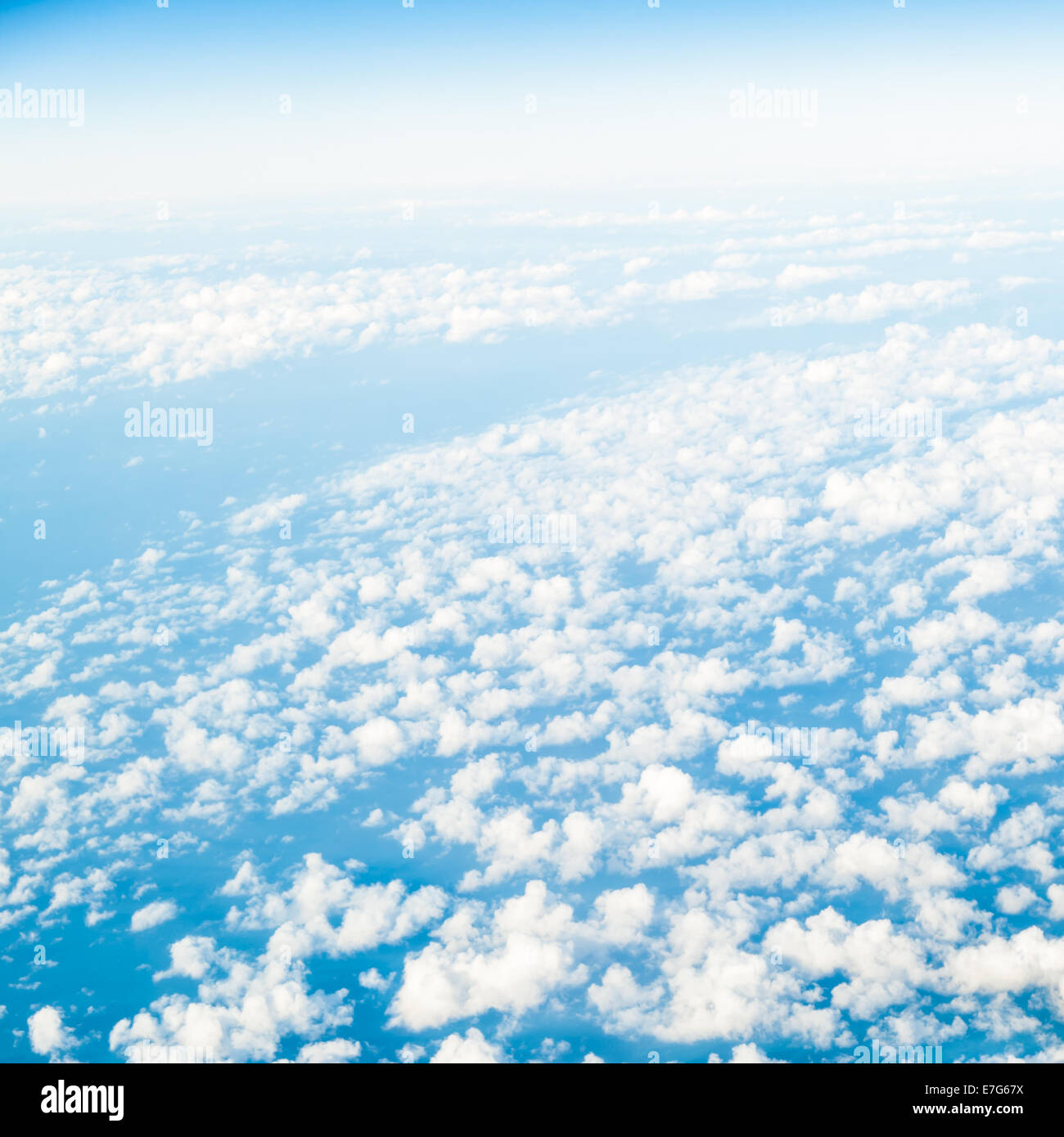 Blue sky. View from window of airplane flying in clouds. Skyscape cloudscape. Bird's eye Stock ...