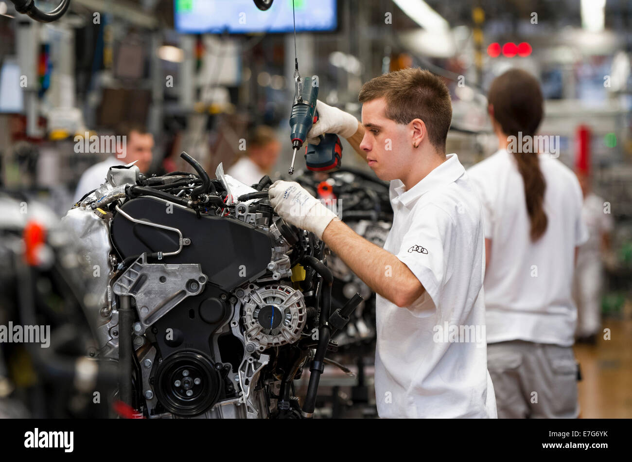 Man working on the production line of the Audi A3 at the Audi plant ...