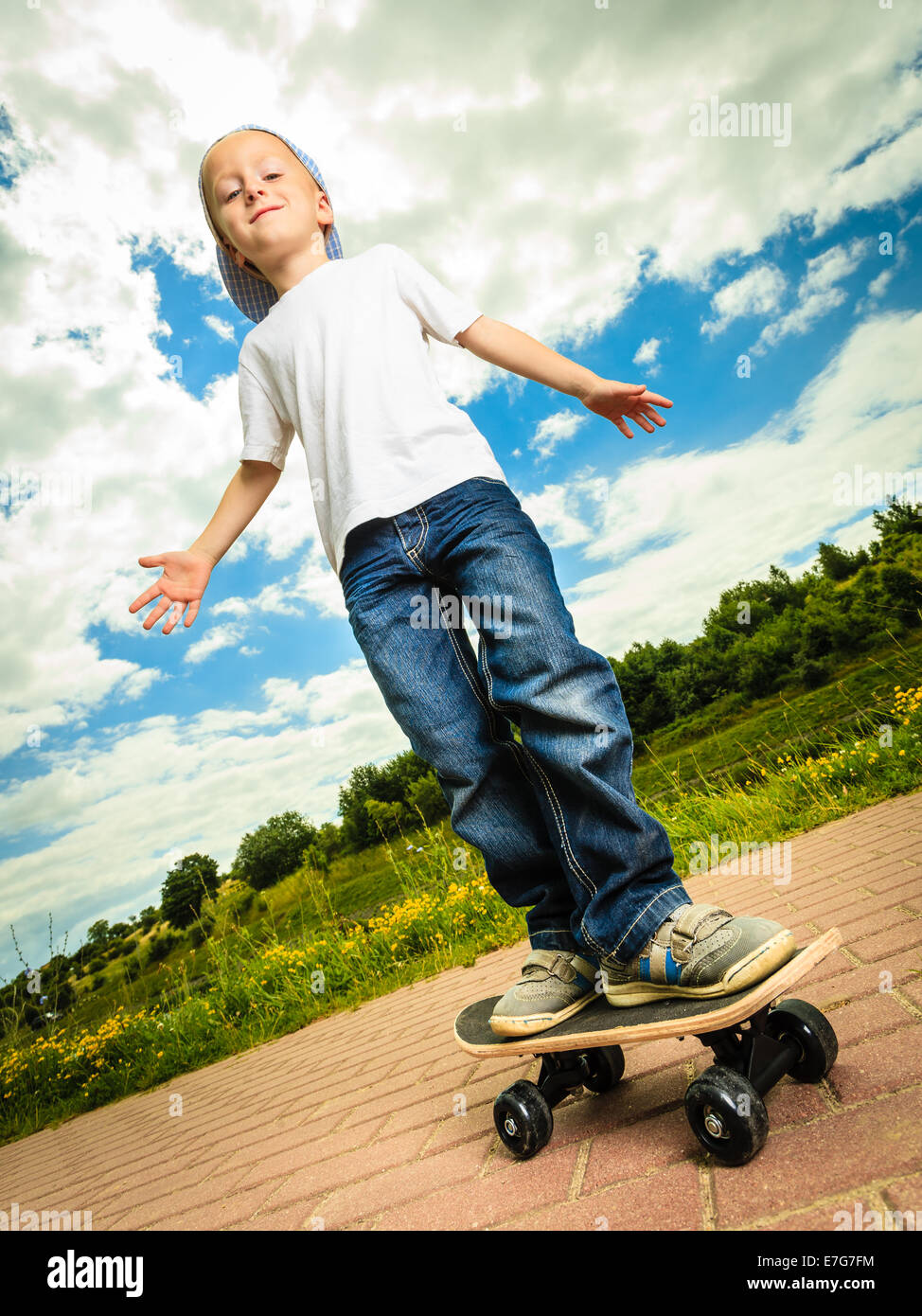 Active childhood. Little man skateboarding. Skater boy child kid with ...
