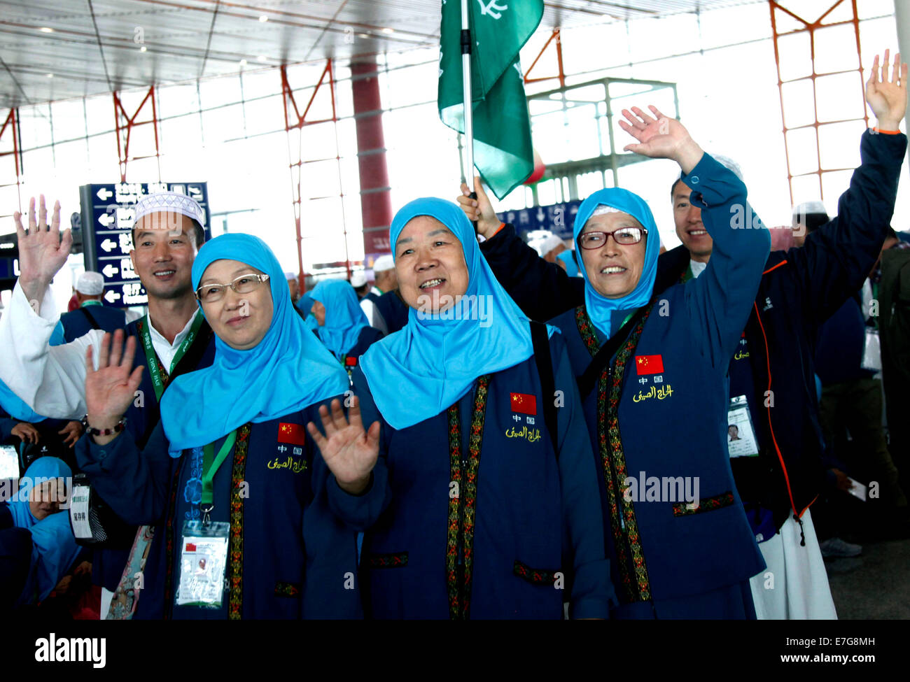 Beijing, China. 17th Sep, 2014. Muslim pilgrims wave goodbye at Beijing ...