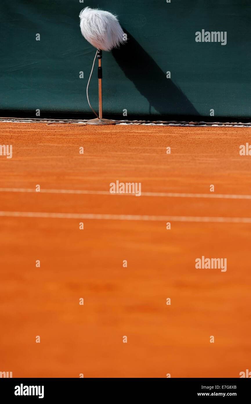 Detail with a professional sport microphone on a clay tennis court ...