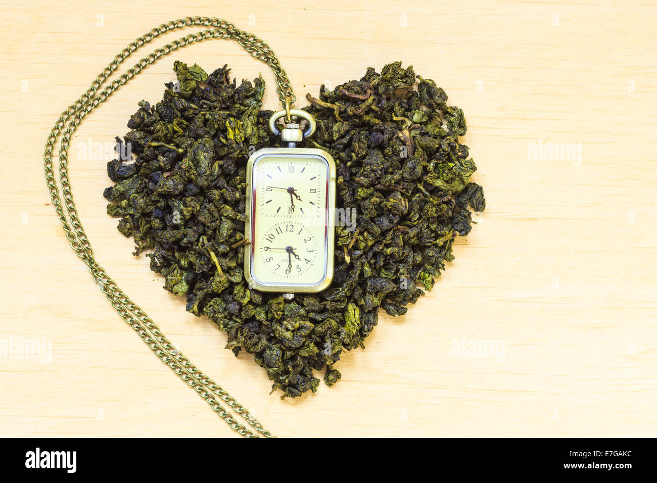 Diet healthcare tea time concept. Green tea heart shaped on wooden ...