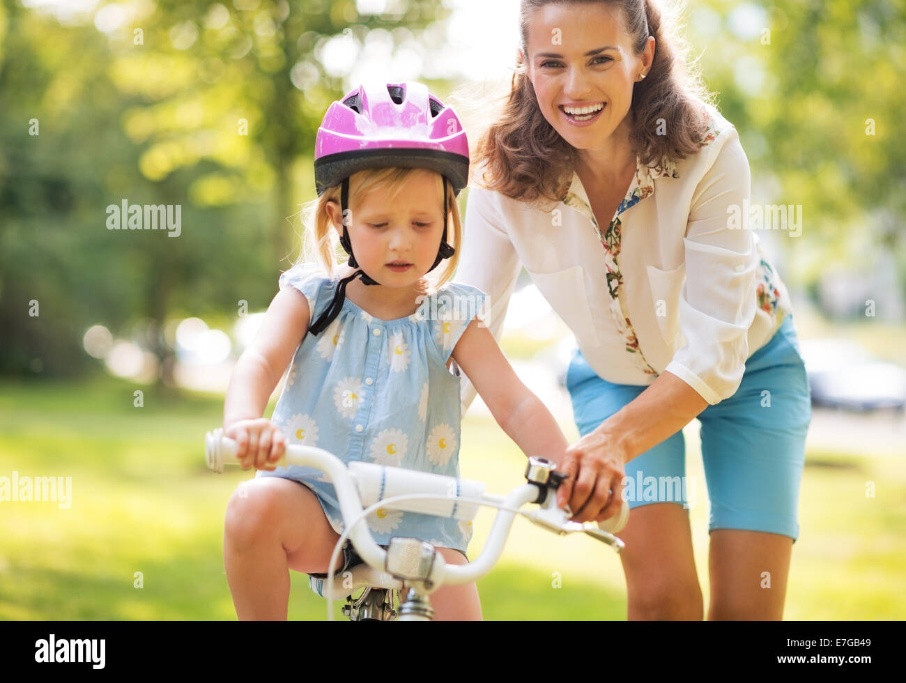 Mother Baby Girl Riding Bicycle High Resolution Stock Photography and ...