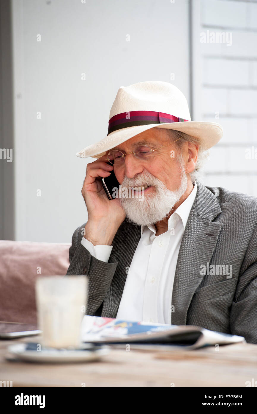 senior man smiling and talking on his cellphone Stock Photo - Alamy