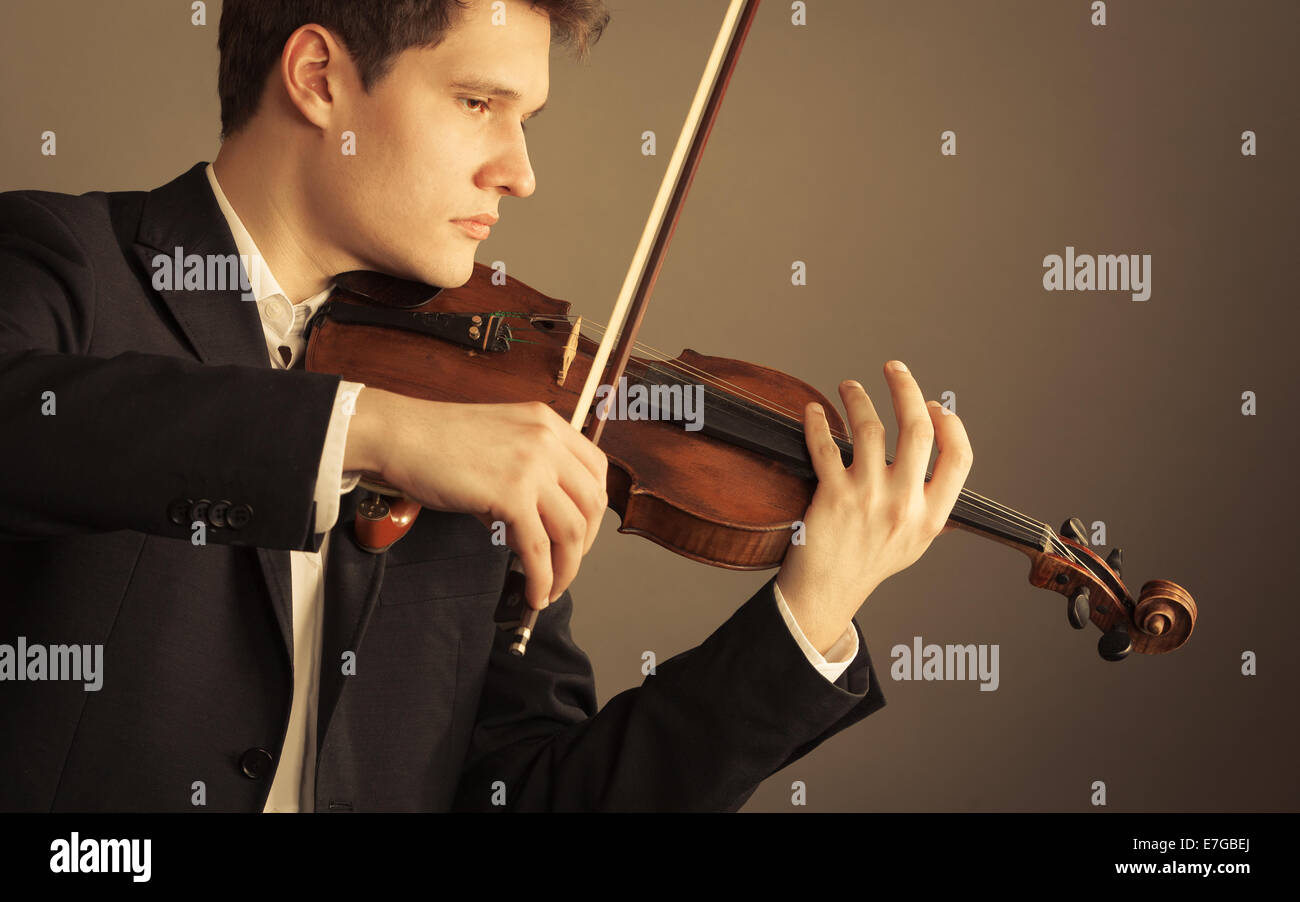 Man violinist playing violin. Classical music art Stock Photo - Alamy