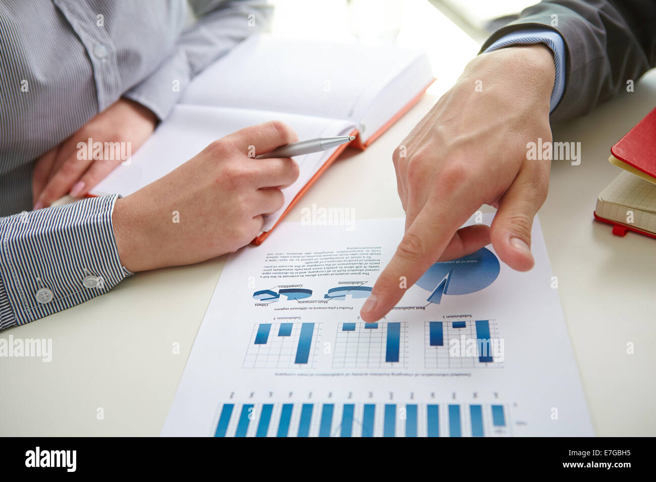 Male hand pointing at business document while explaining it Stock Photo ...
