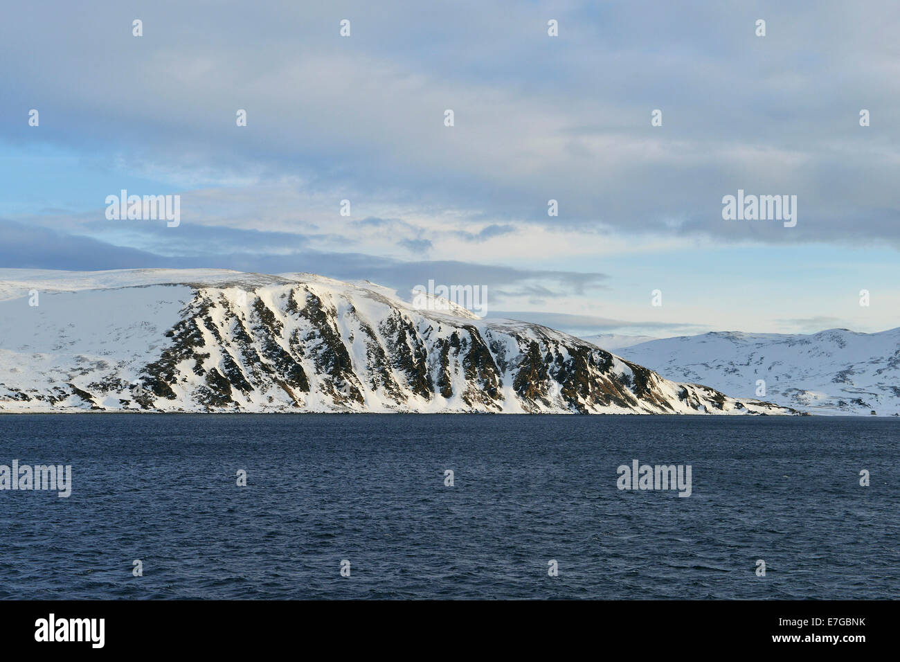 Snowy coast of the rock island Magerøya in the Norwegian Sea, 23 ...