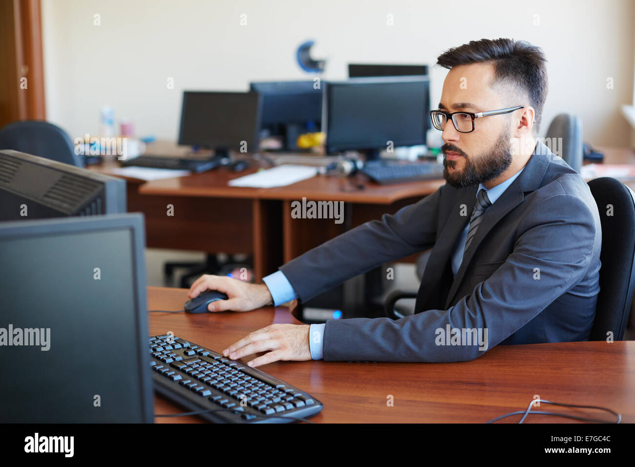 Calm employee man using computer hi-res stock photography and images ...