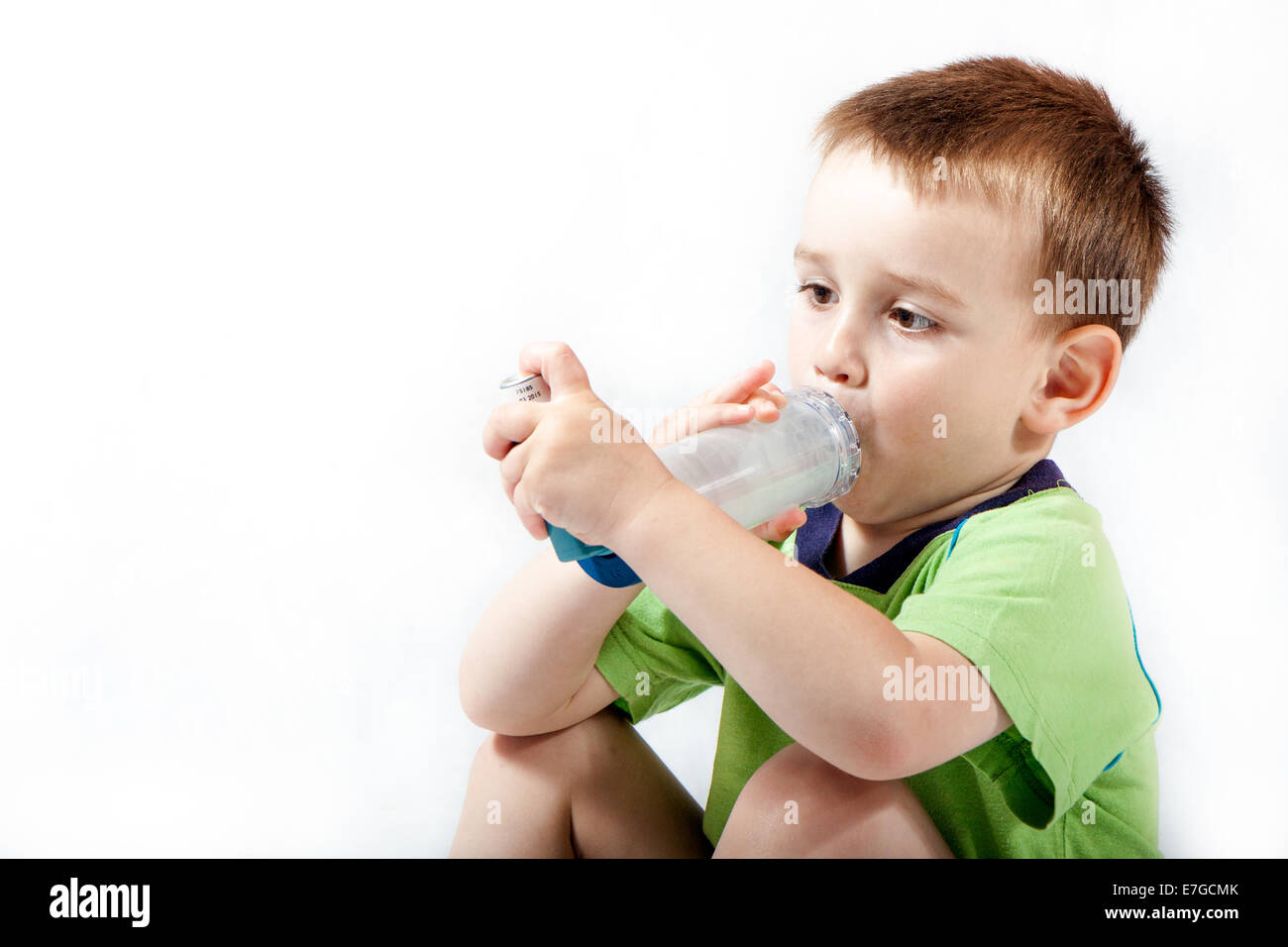 Little boy using inhaler for asthma isolated on white background Stock ...