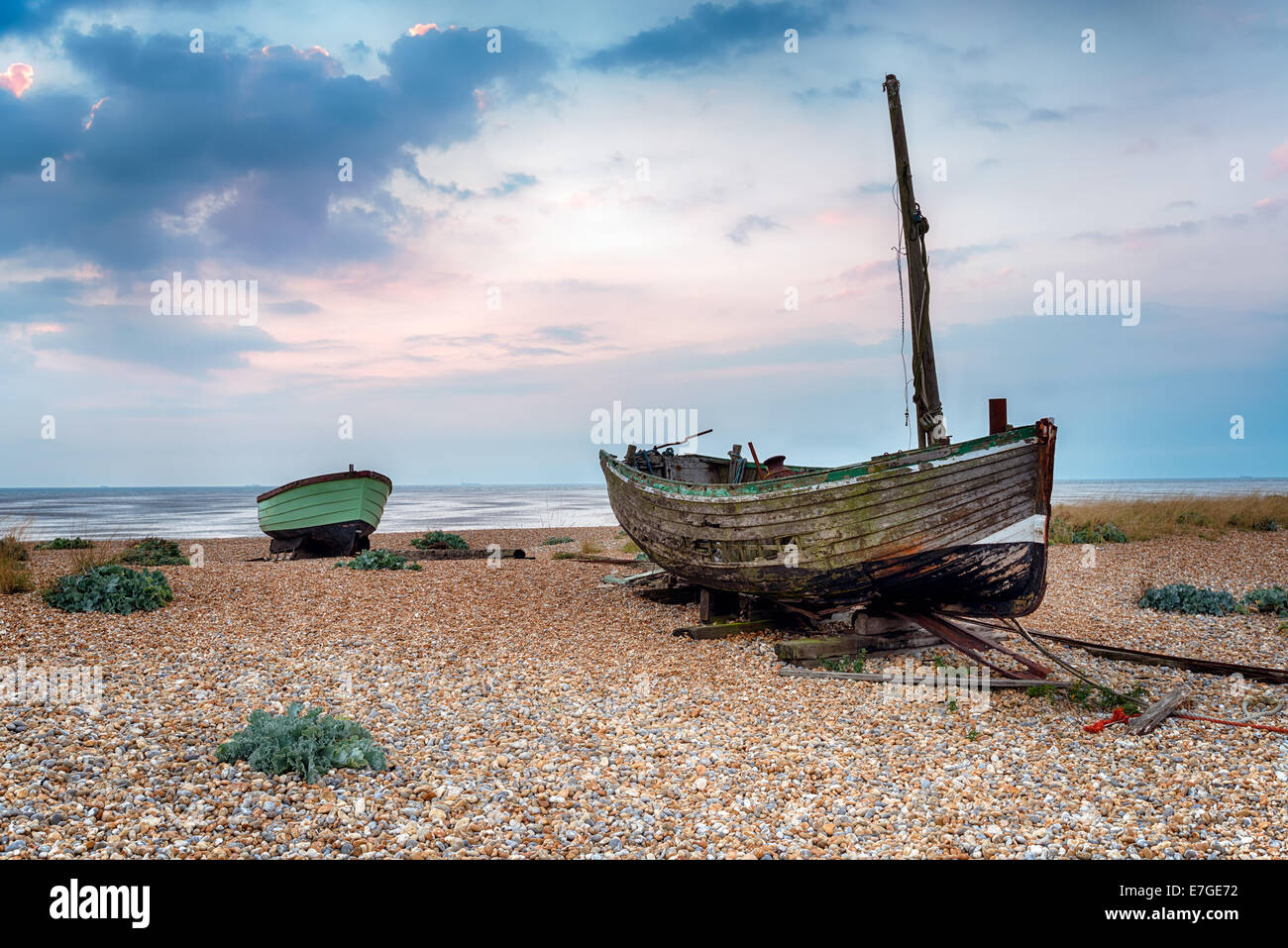 Fishing boats on a shingle beach at Lydd-on-Sea in Romney Marsh, Kent ...