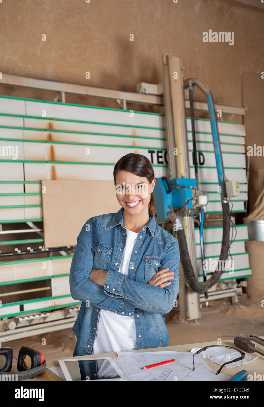 Confident Female Carpenter At Table Stock Photo - Alamy