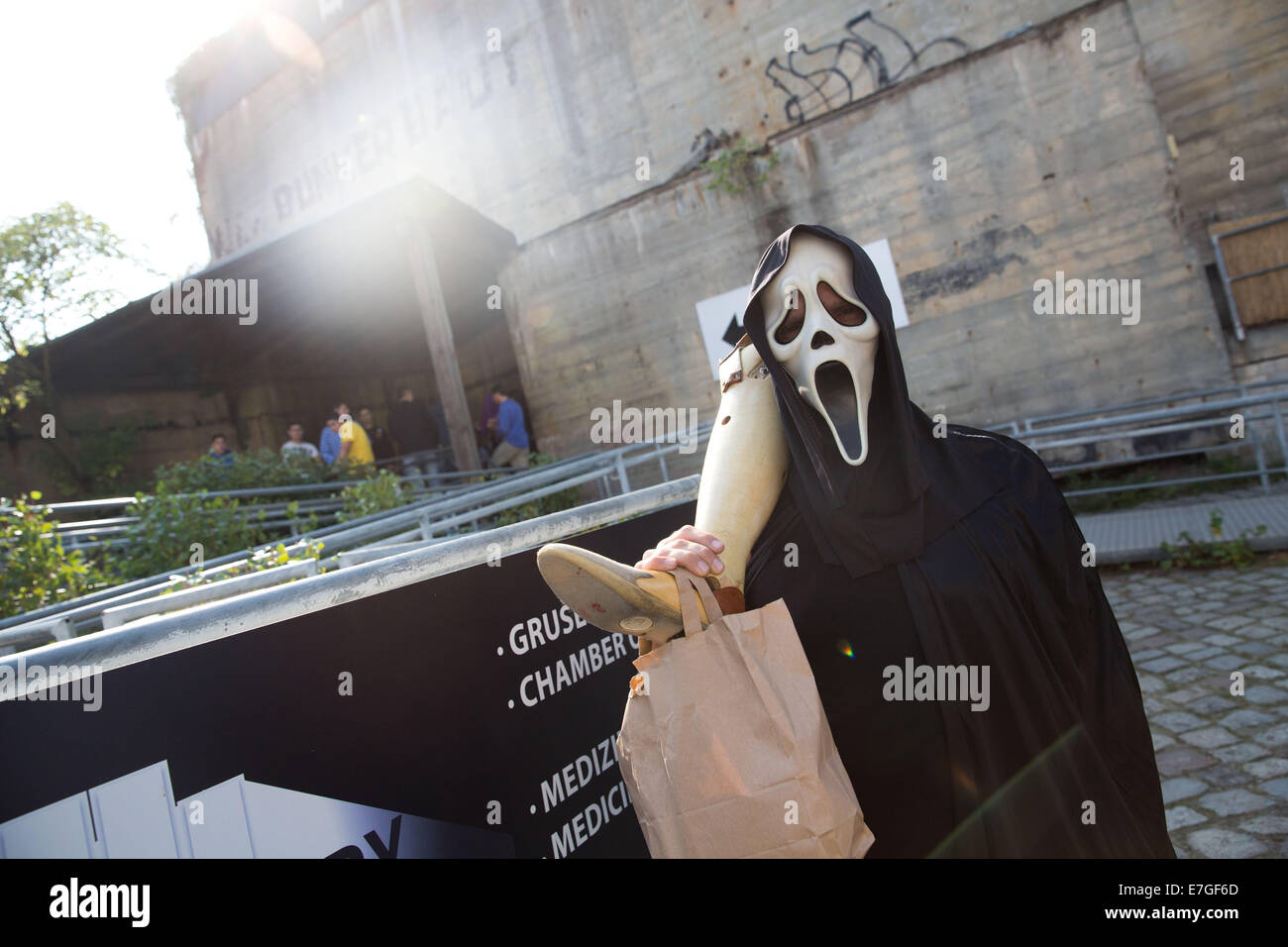 Berlin, Germany. 17th Sep, 2014. A person in a costume attends a scare ...
