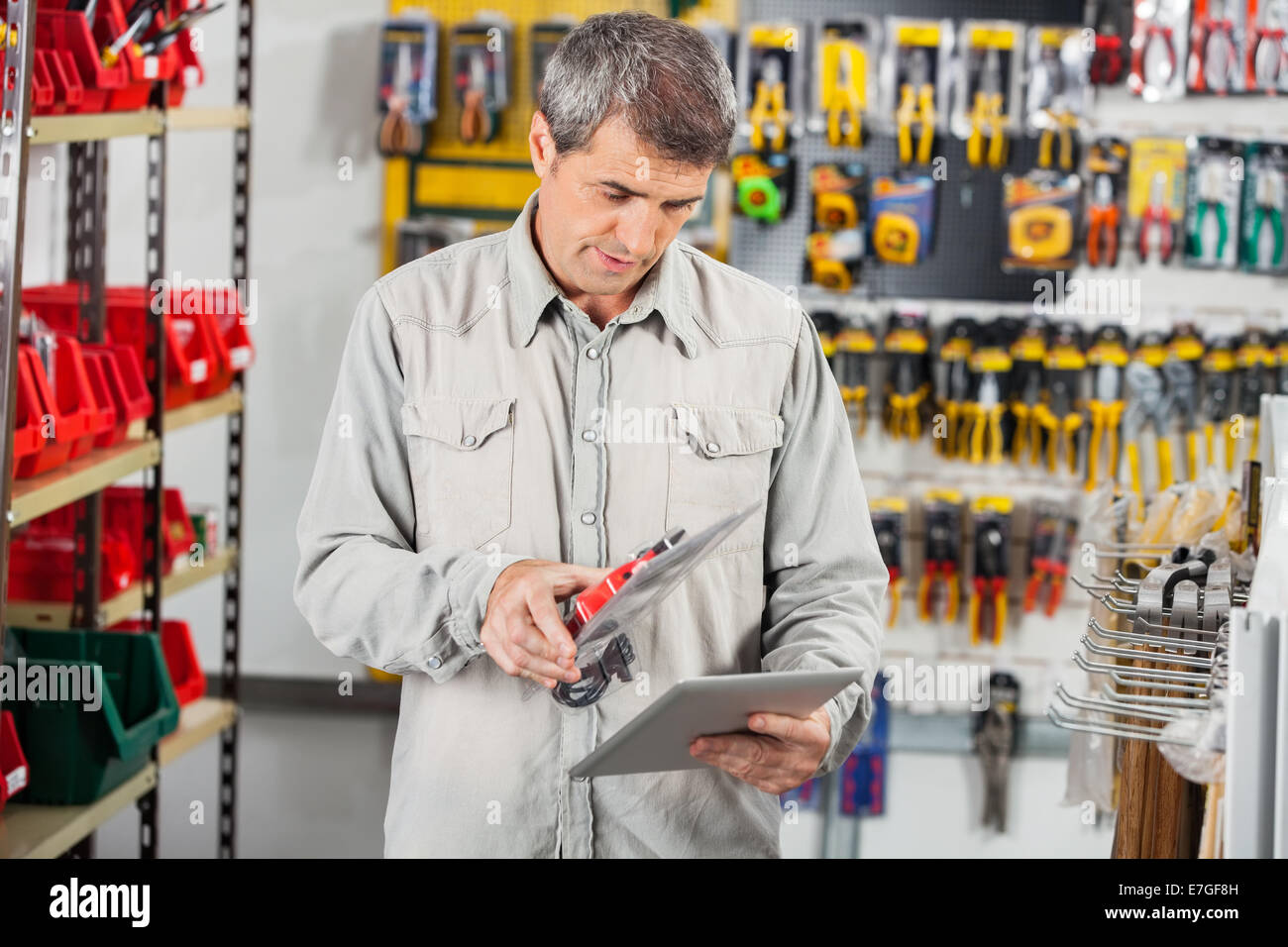 Man Scanning Product Through Digital Tablet Stock Photo - Alamy